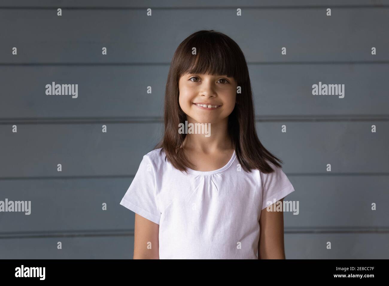 Head shot portrait smiling little girl on grey studio background Stock ...