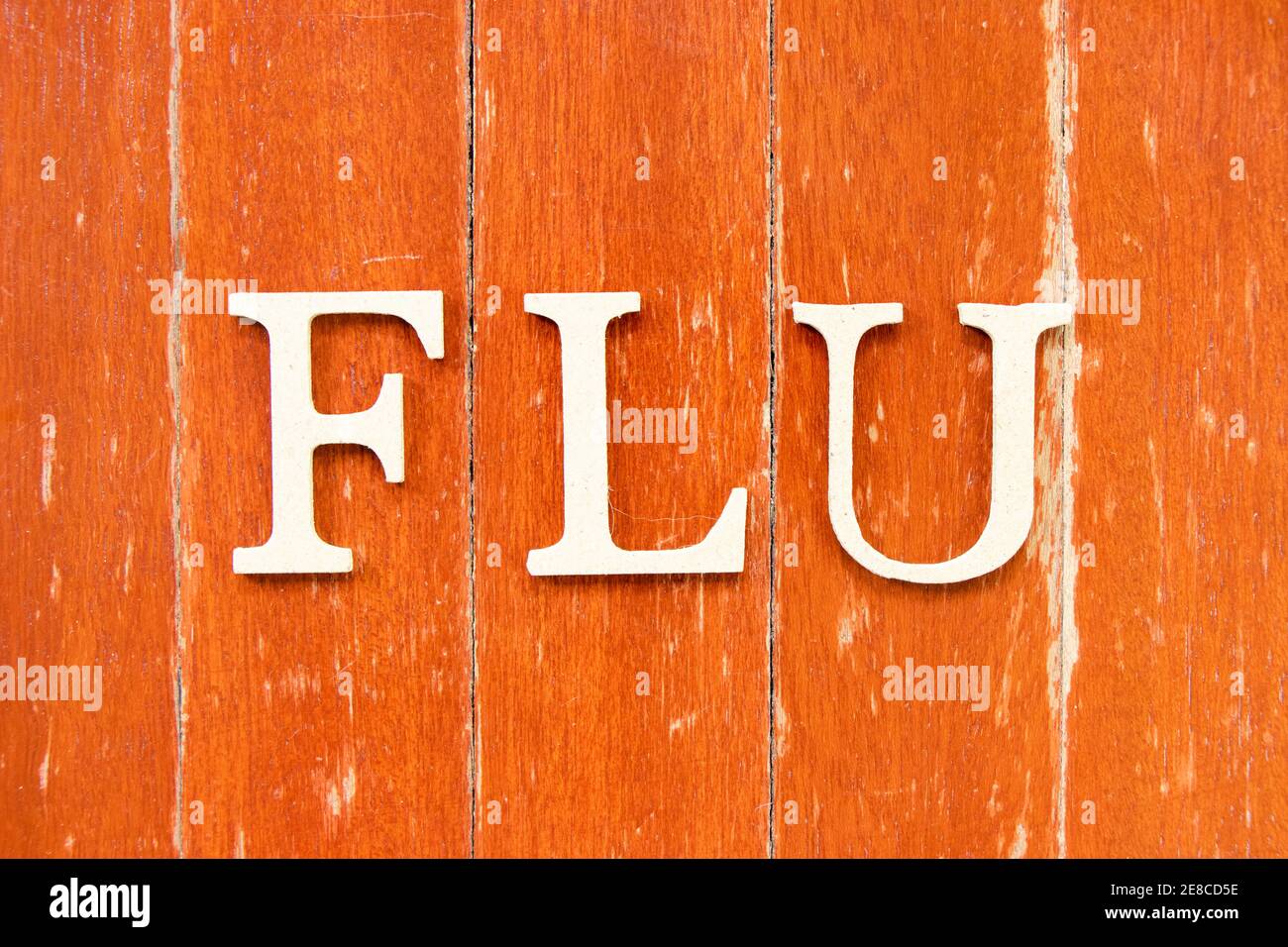 Alphabet letter in word flu on old red color wood plate background ...