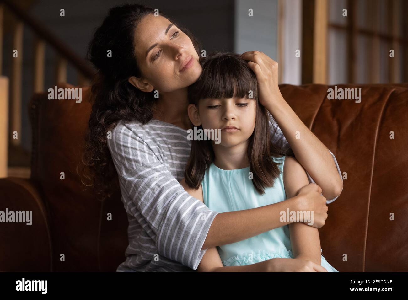 Mother hugging daughter sad hi-res stock photography and images - Alamy