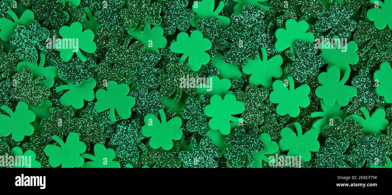 Shamrock confetti texture background banner filled with green lucky ...