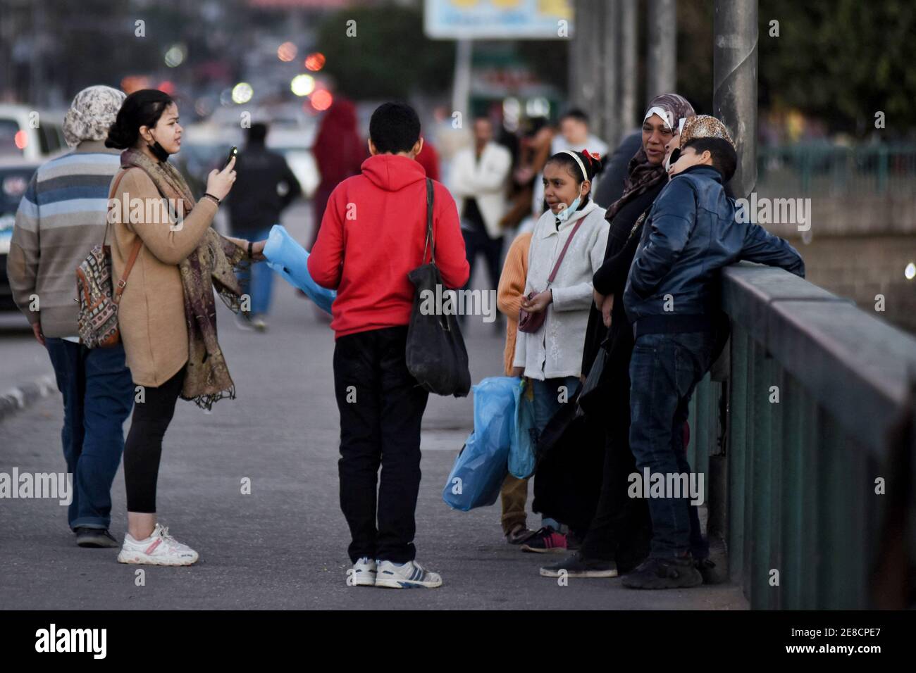 January 30, 2021: Greater Cairo, Egypt. 30 January 2021. Passers-by ...