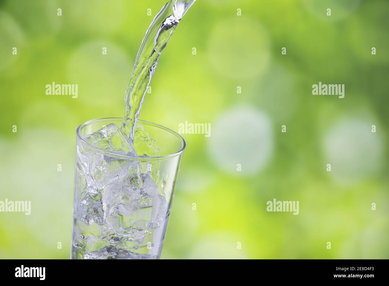 water pouring into glass Stock Photo - Alamy