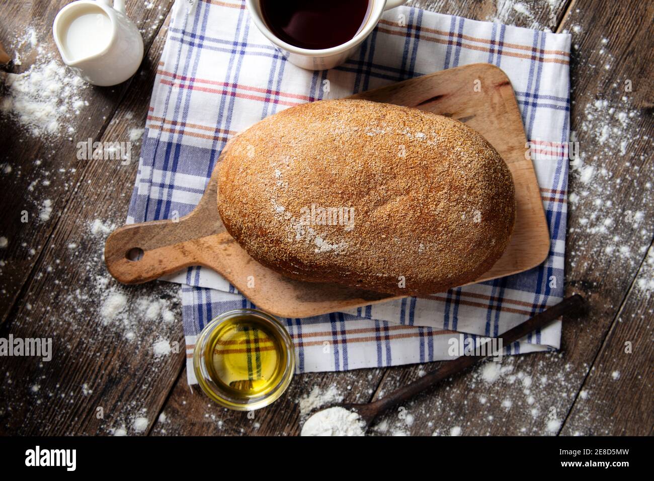Top view on gray loaf of bread with olive oil Stock Photo - Alamy