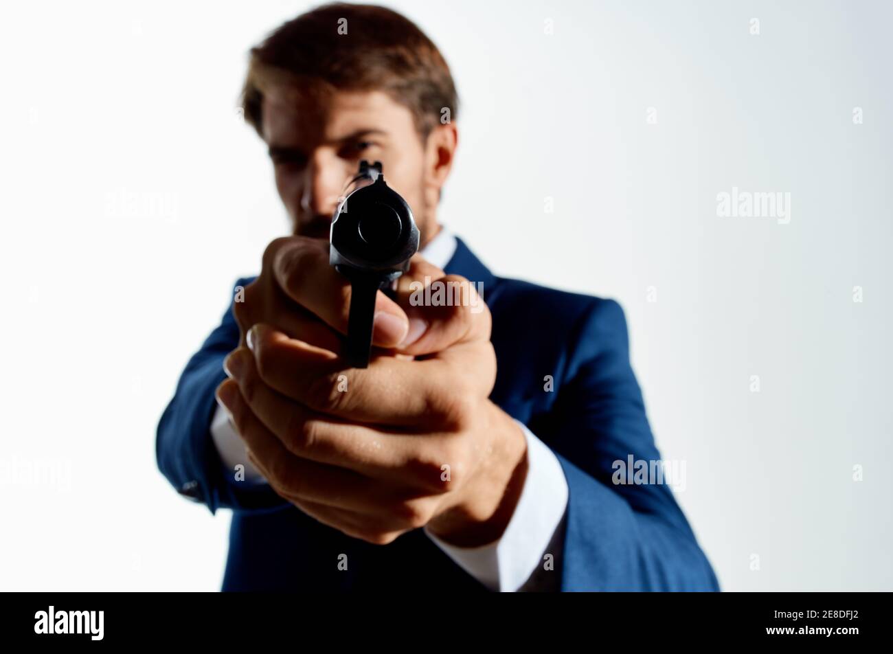 bearded man in suit gun close up killer murder light background Stock ...