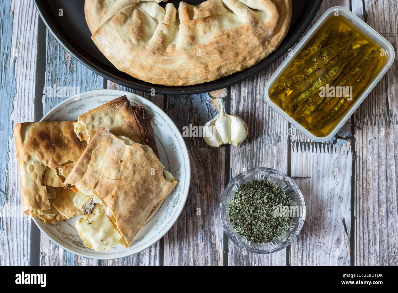 Pizza Puff with Anchovies. Traditional peasant dish Stock Photo - Alamy