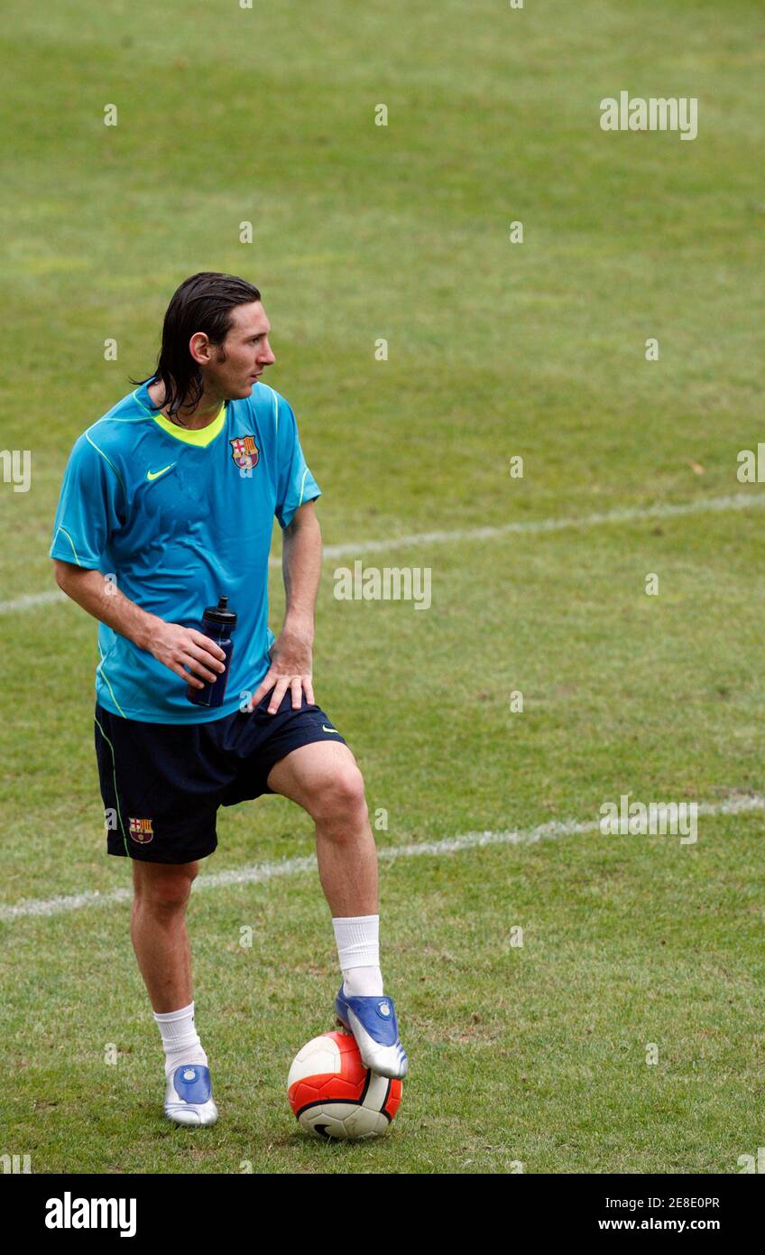 Barcelonas lionel messi attends training hi-res stock photography and ...