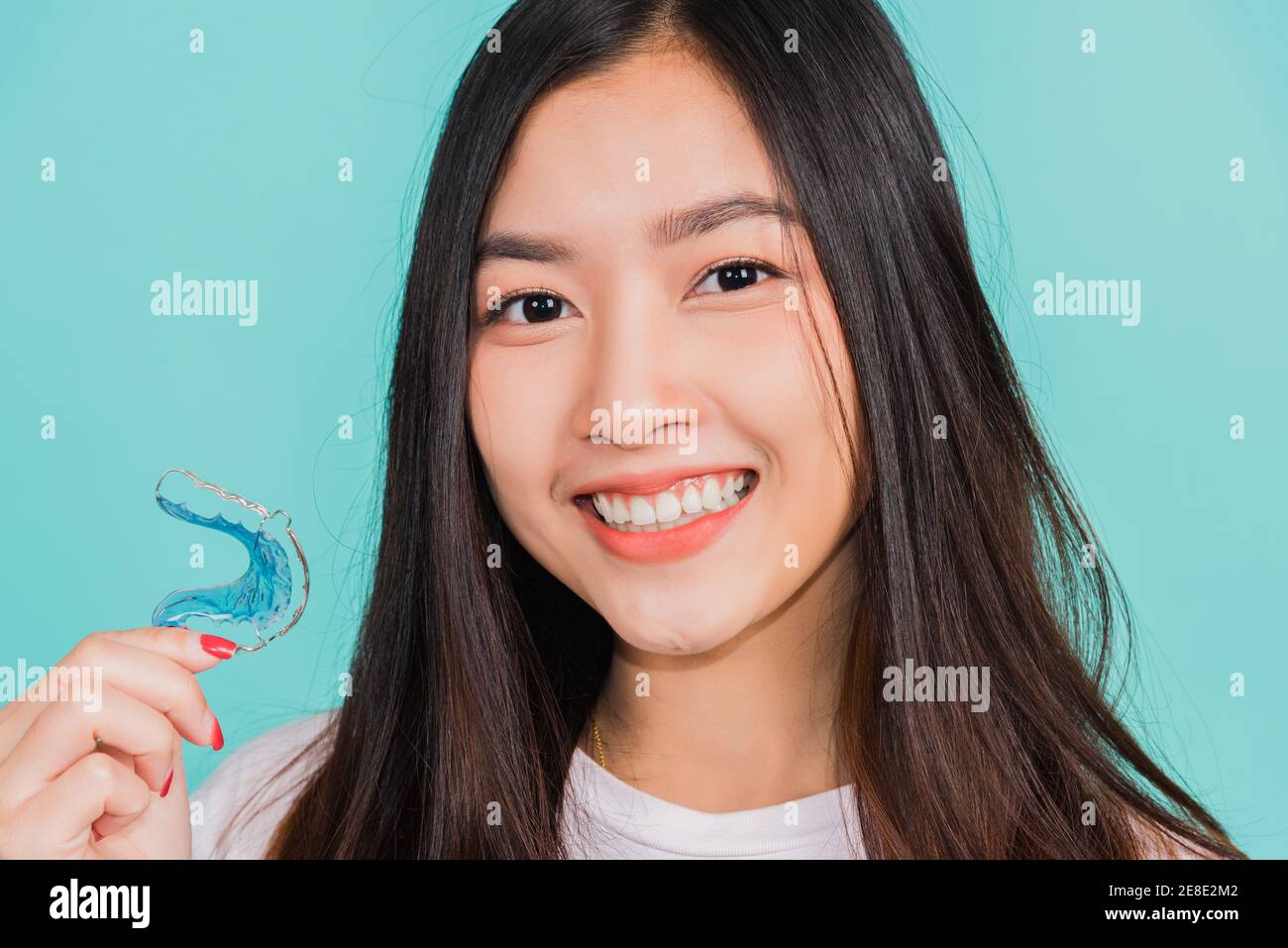 Portrait young Asian beautiful woman smiling holding silicone ...