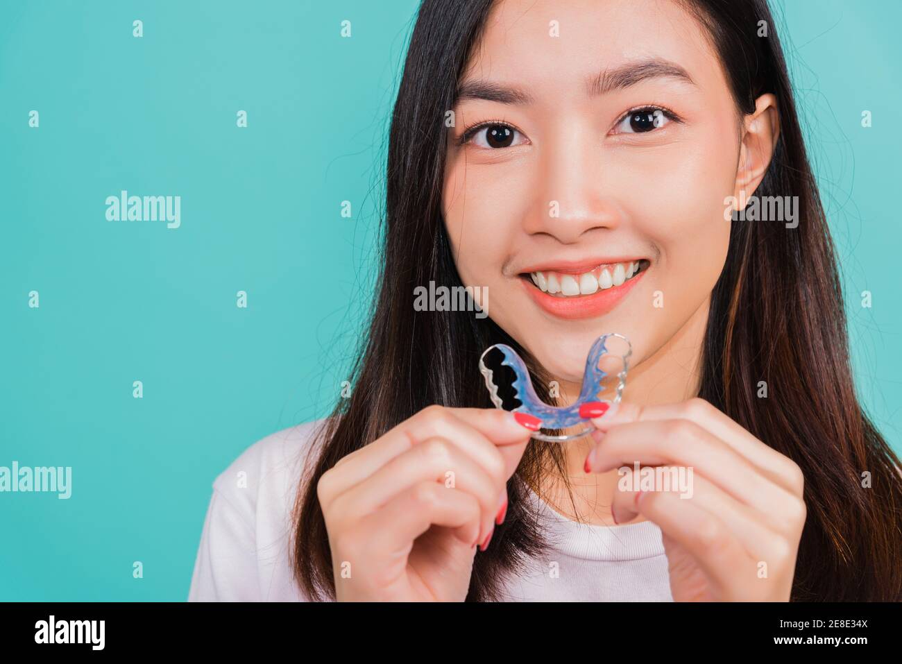 Teeth retaining tools after removable braces, Portrait young Asian ...