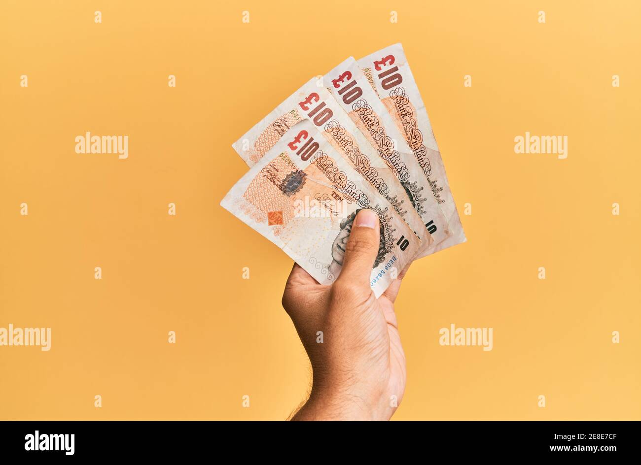 Hand holding uk cash isolated hi-res stock photography and images - Alamy