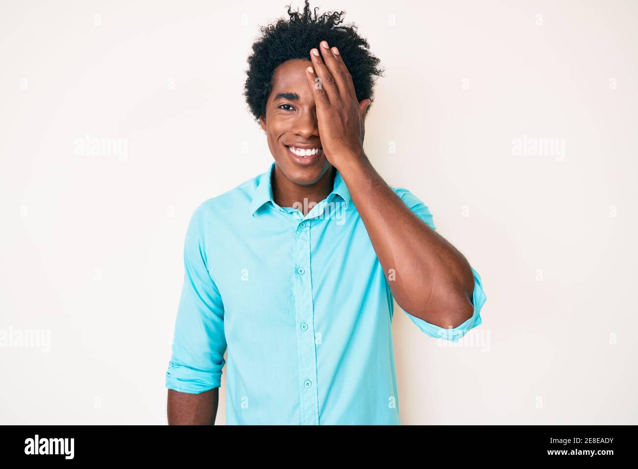 Handsome african american man with afro hair wearing casual clothes ...