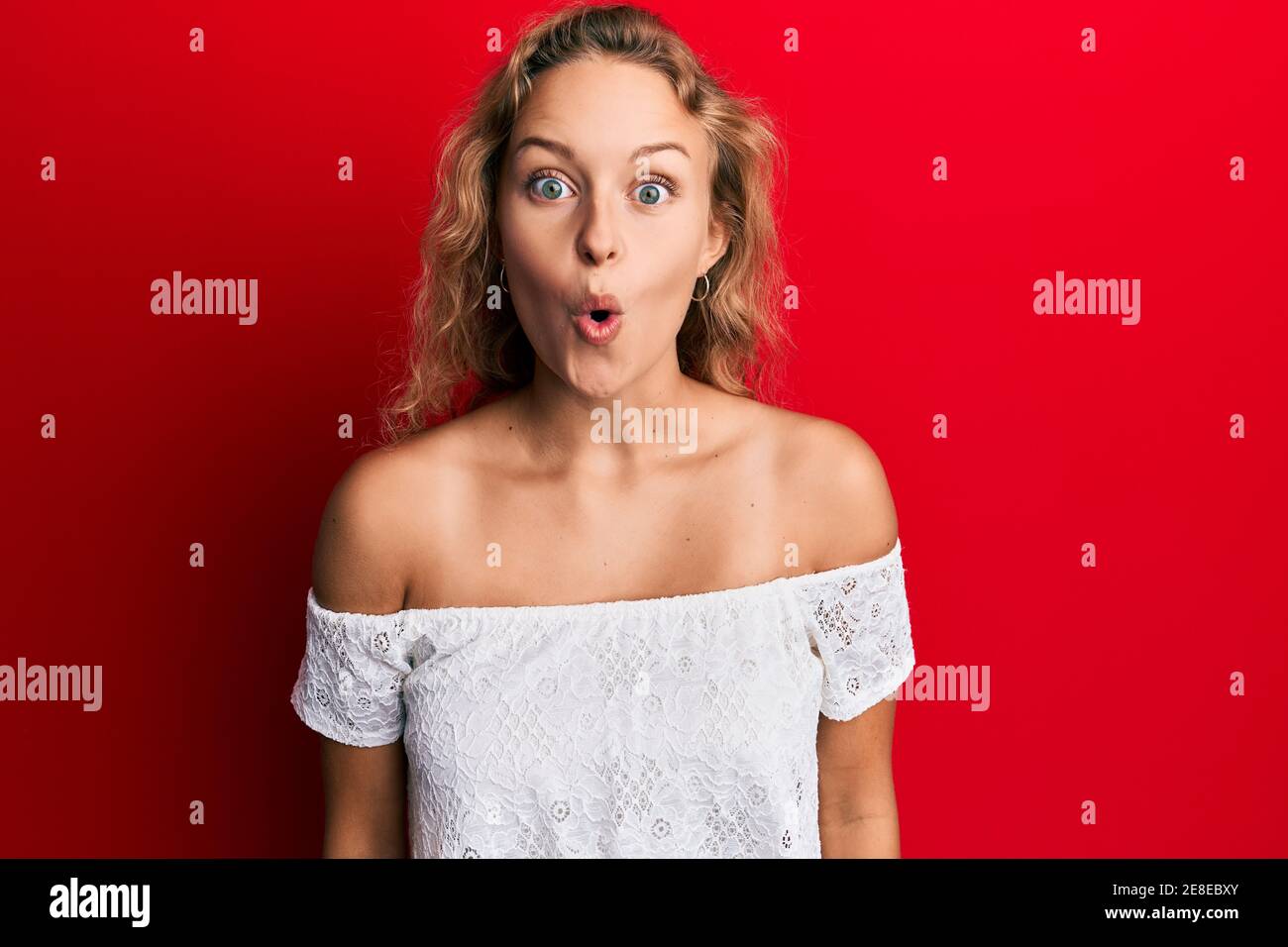 Beautiful Caucasian Woman Wearing Casual Clothes Over Red Background