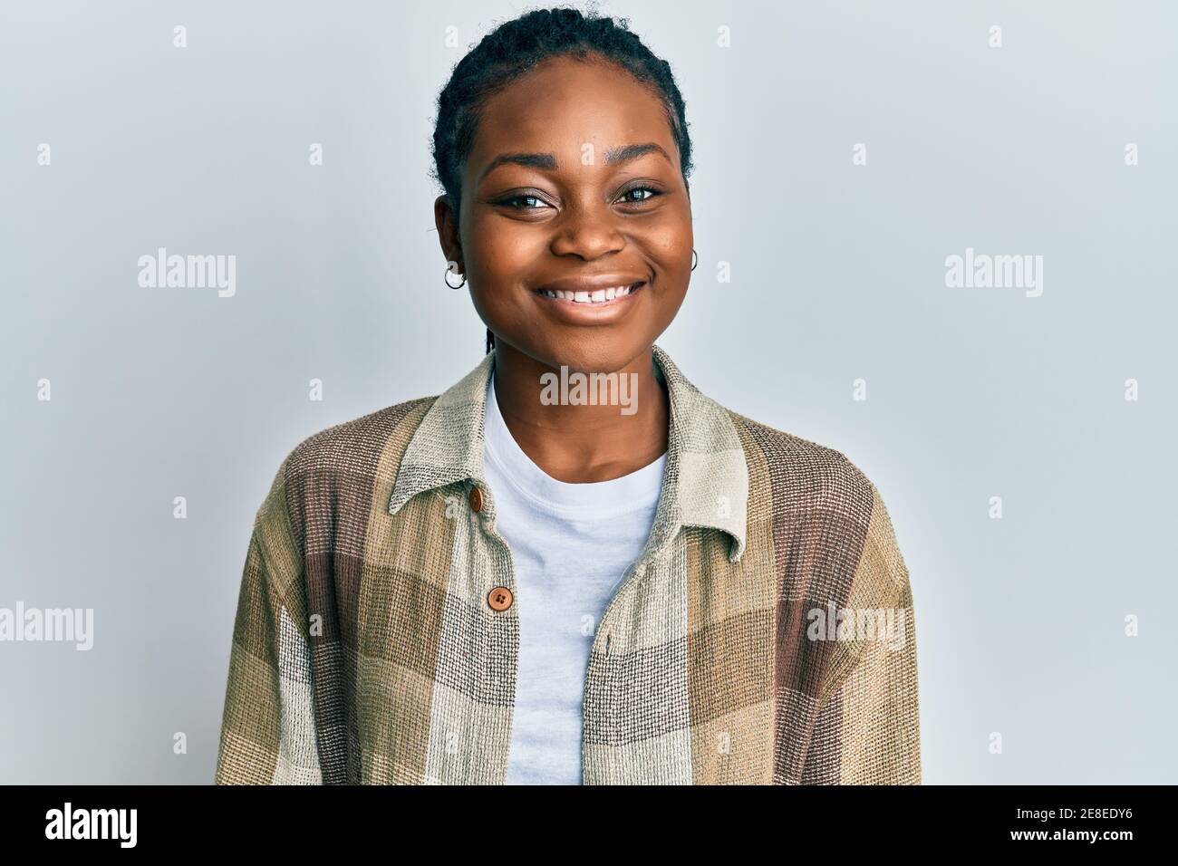 Young african american woman wearing casual clothes with a happy and ...