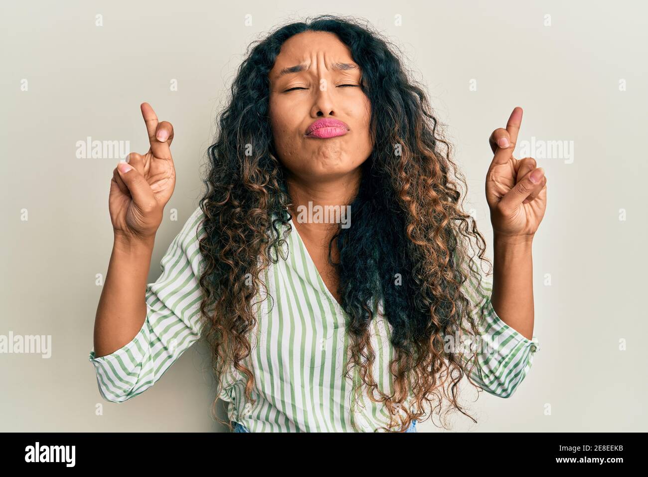 Young Latin Woman Wearing Casual Clothes Gesturing Finger Crossed 6042