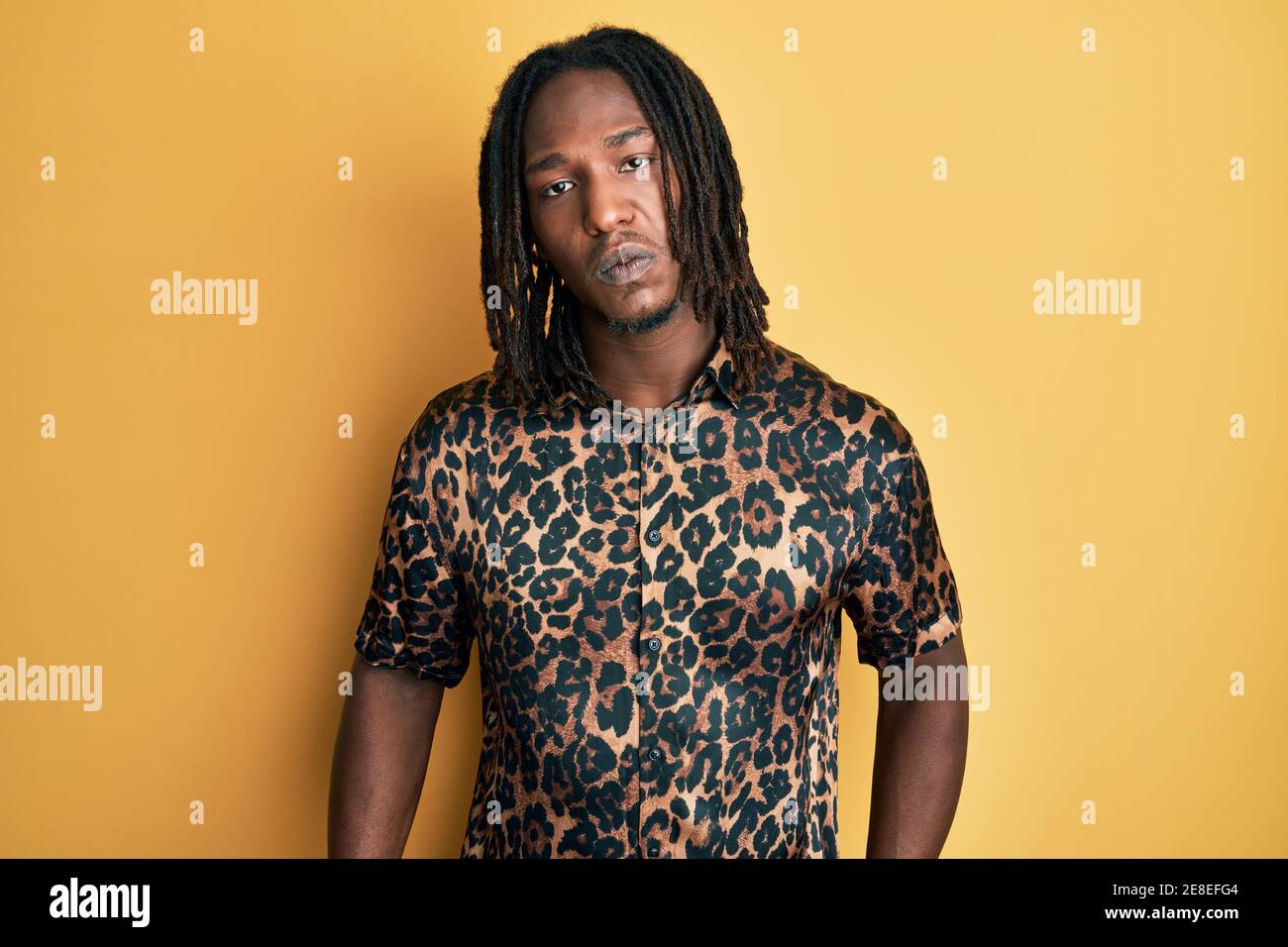 African american man with braids wearing leopard animal print shirt ...