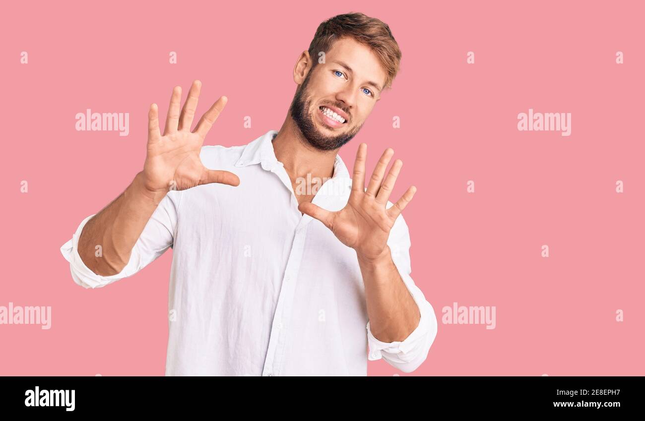 Young caucasian man wearing casual clothes afraid and terrified with ...