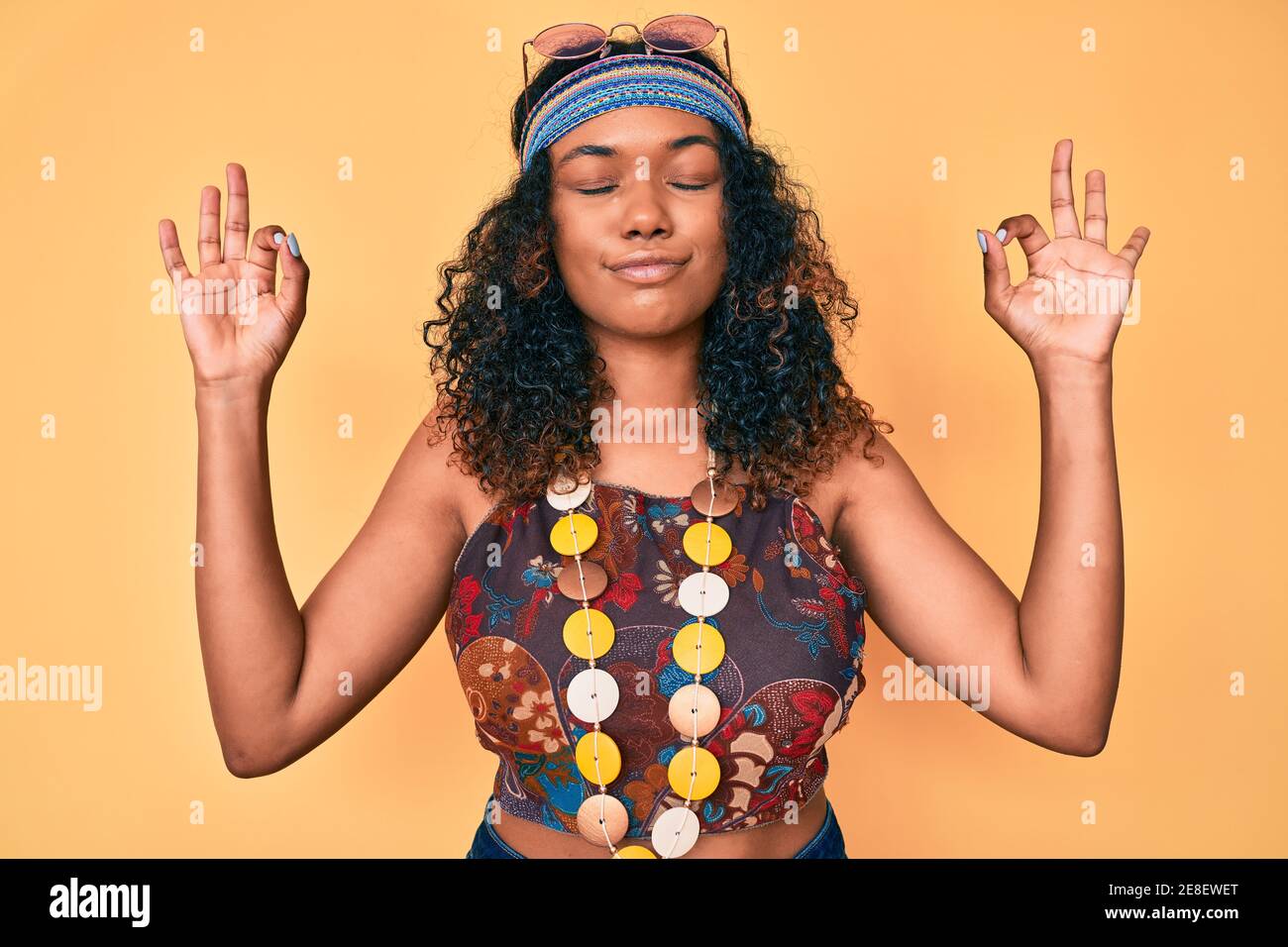 Hippy woman meditating hi-res stock photography and images - Alamy