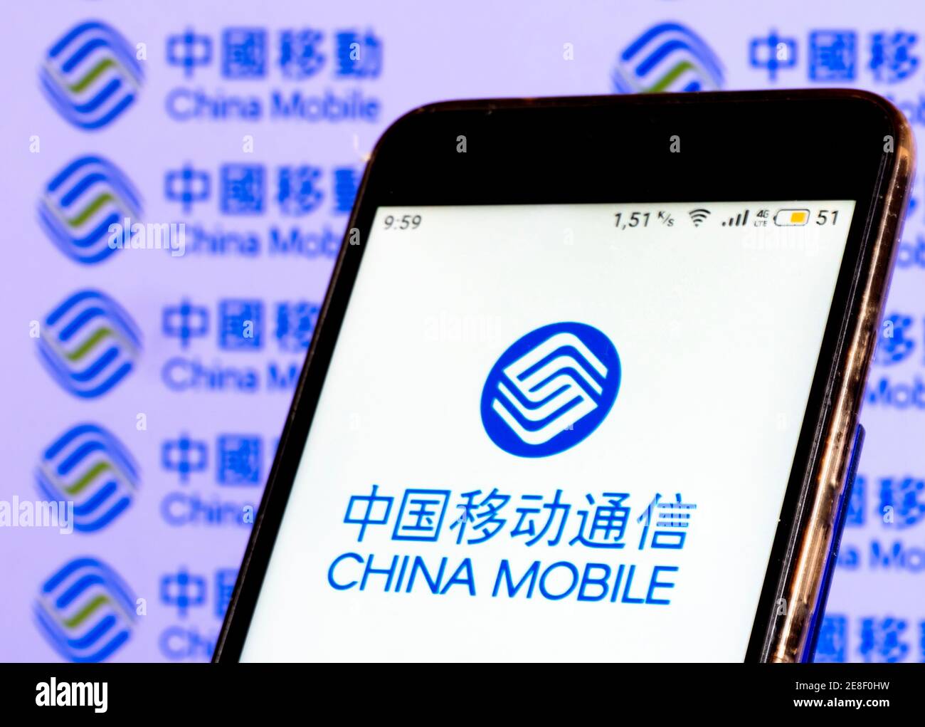 In this photo illustration a China Mobile logo is seen displayed on a ...