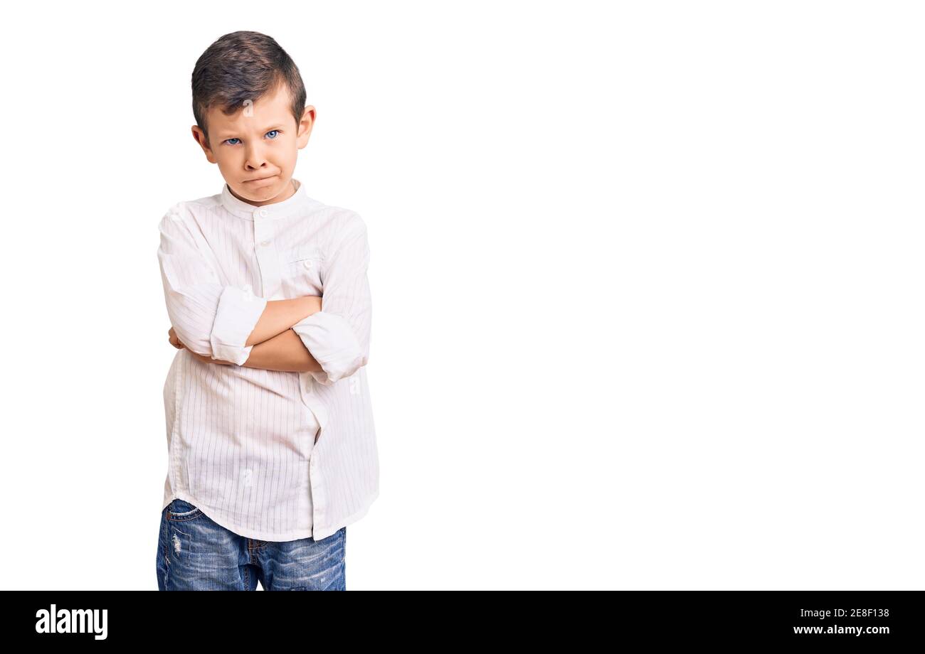 Cute blond kid wearing elegant shirt skeptic and nervous, disapproving ...