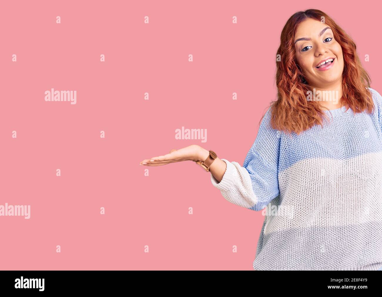 Young latin woman wearing casual clothes clueless and confused ...