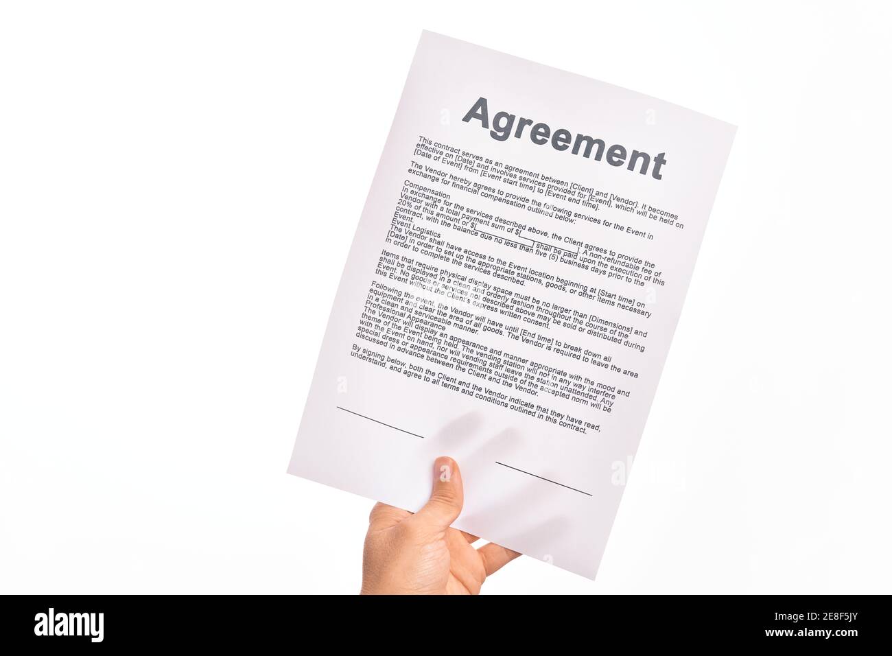 Holding agreement paper over isolated white background Stock Photo - Alamy