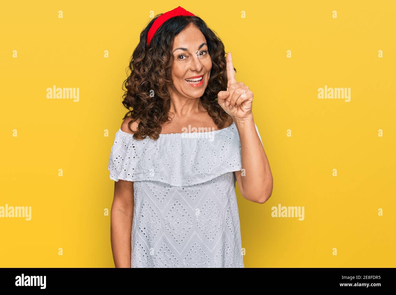 Middle Age Hispanic Woman Wearing Casual Clothes Pointing Finger Up