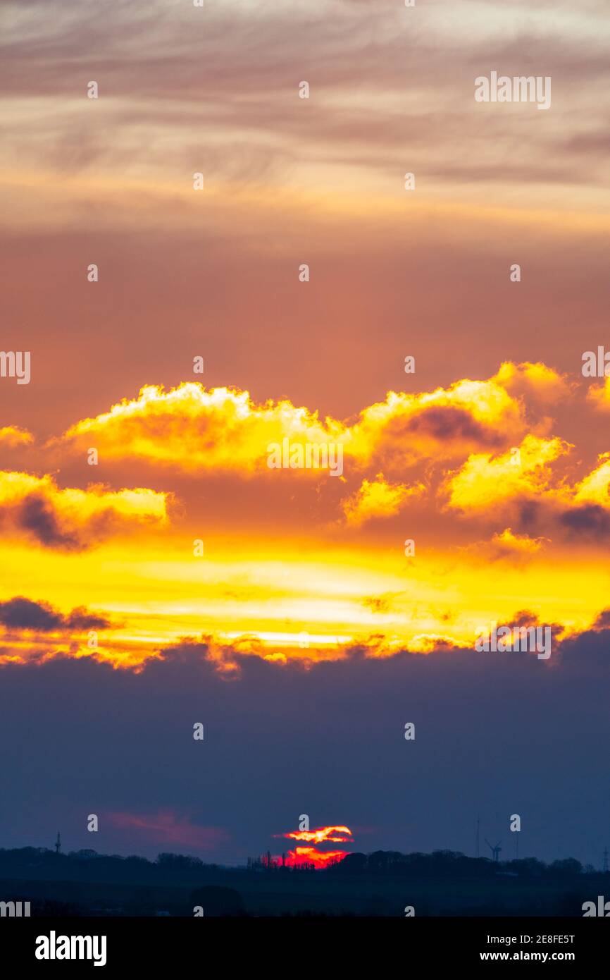 Sunrise over the South East Kent with the sun looking red appearing ...