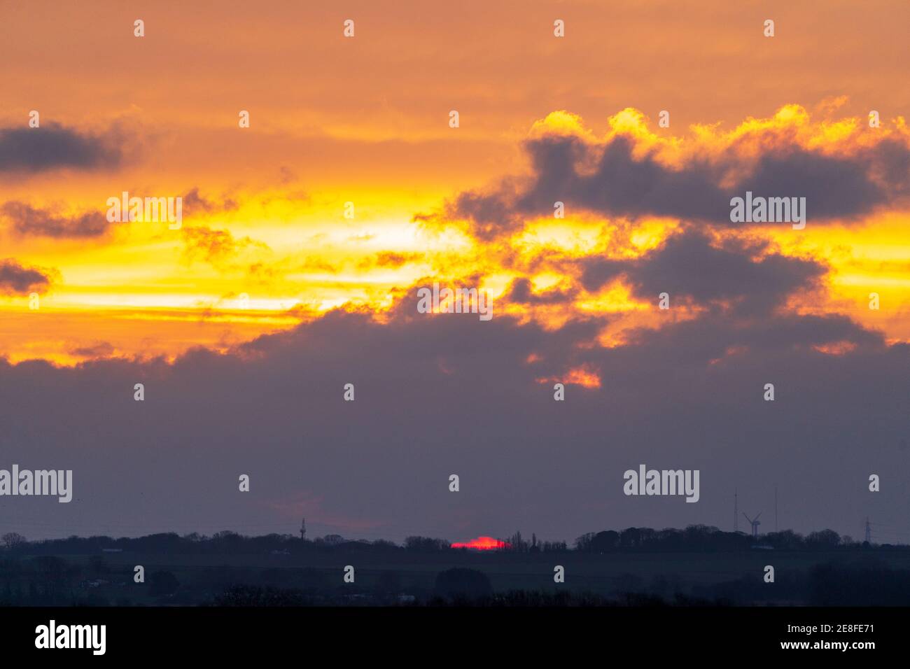 Sunrise over the South East Kent with the sun looking red appearing ...