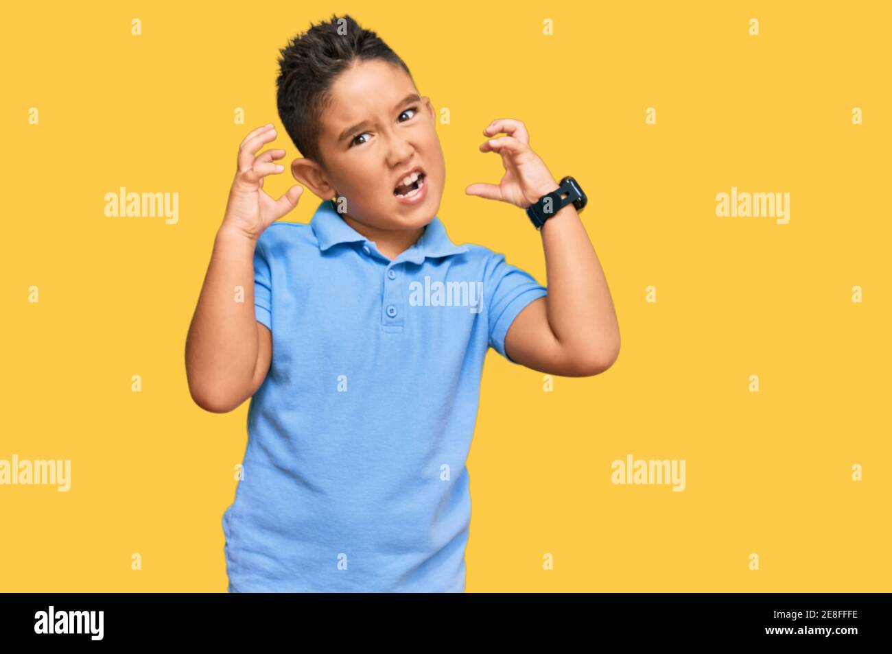 Little boy hispanic kid wearing casual clothes shouting frustrated with ...