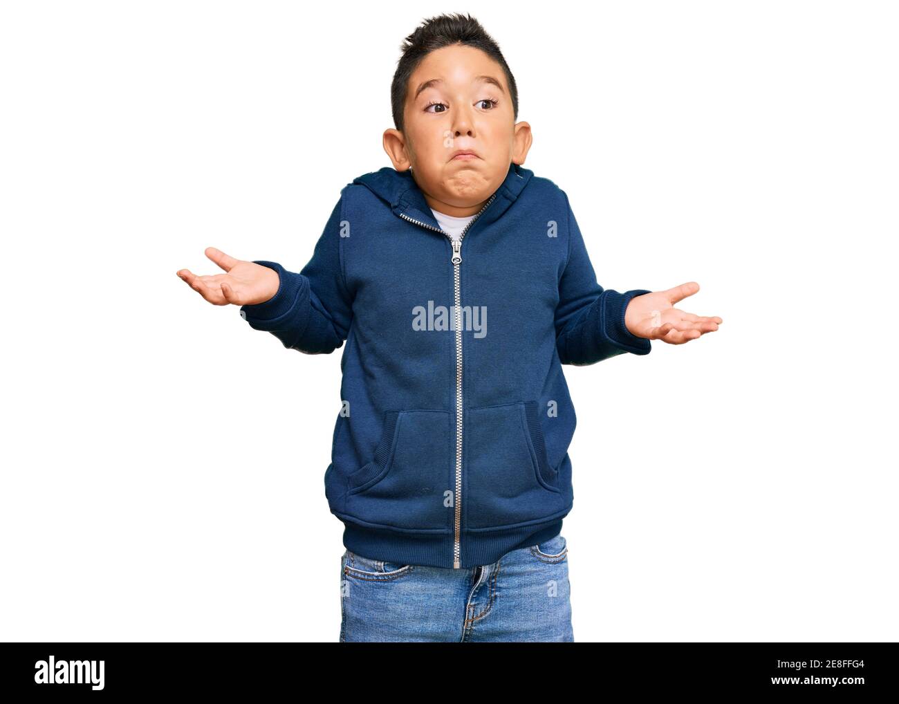 Little boy hispanic kid wearing casual sporty jacket clueless and ...