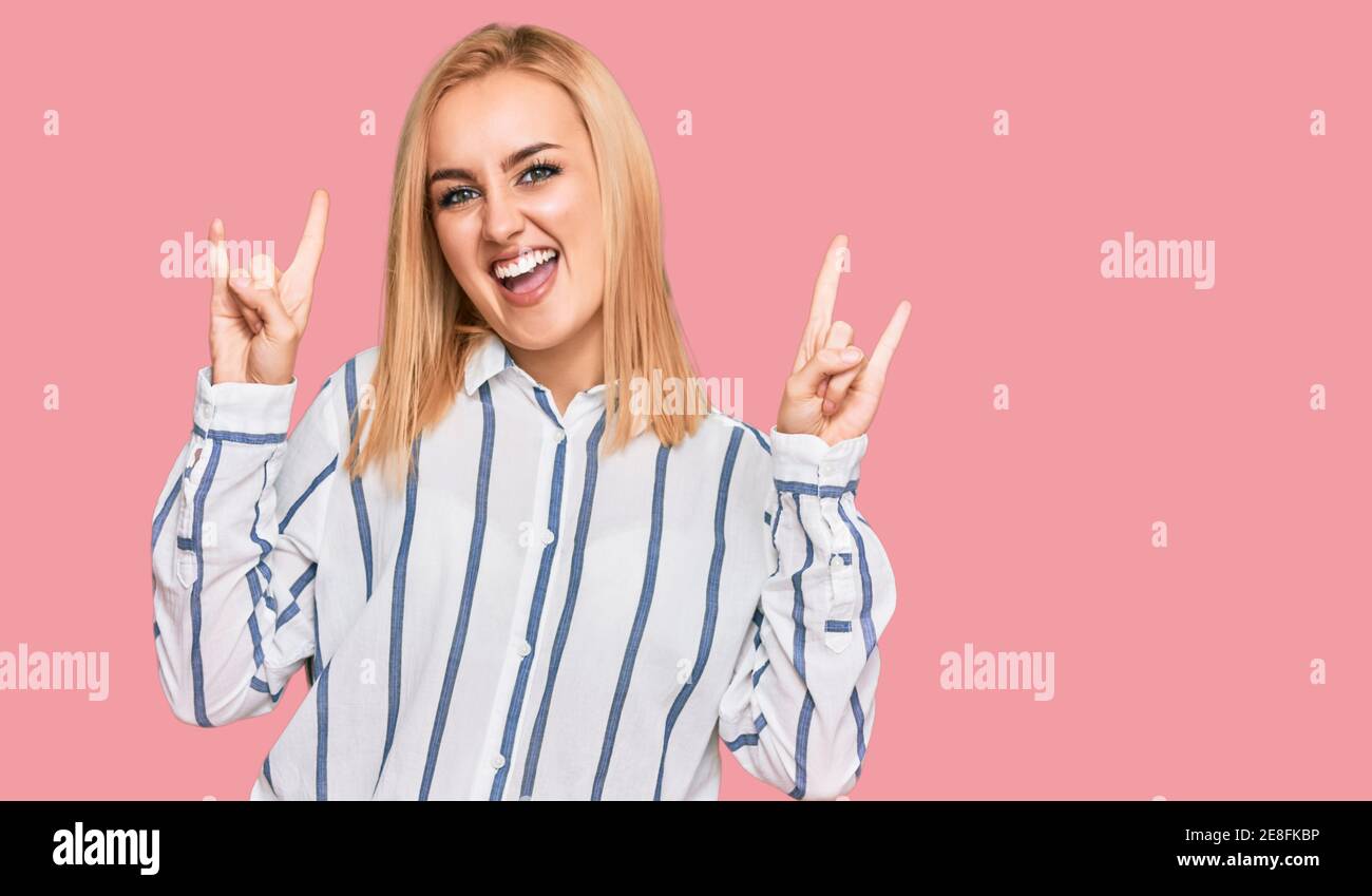 Beautiful caucasian woman wearing casual clothes shouting with crazy ...