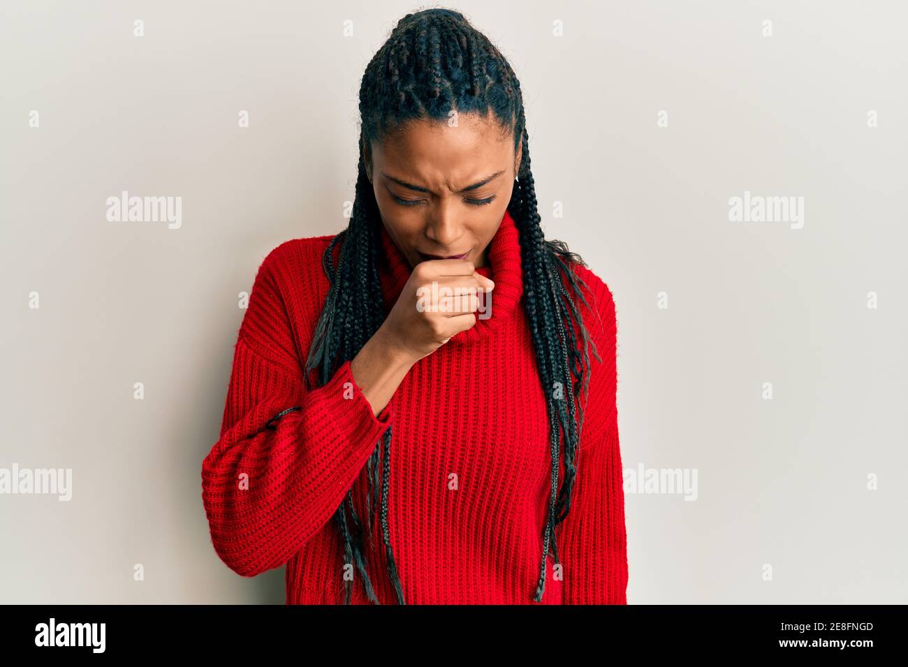 African american woman wearing casual winter sweater feeling unwell and ...