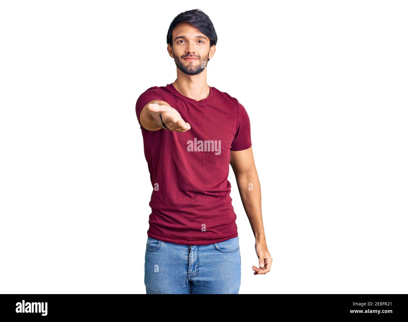 Handsome hispanic man wearing casual clothes smiling cheerful offering ...