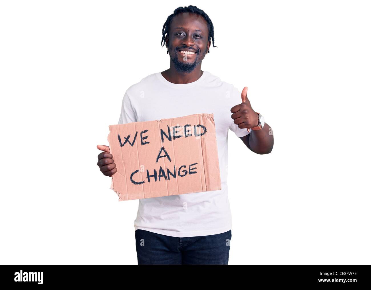 Young african american man with braids holding we need a change banner ...