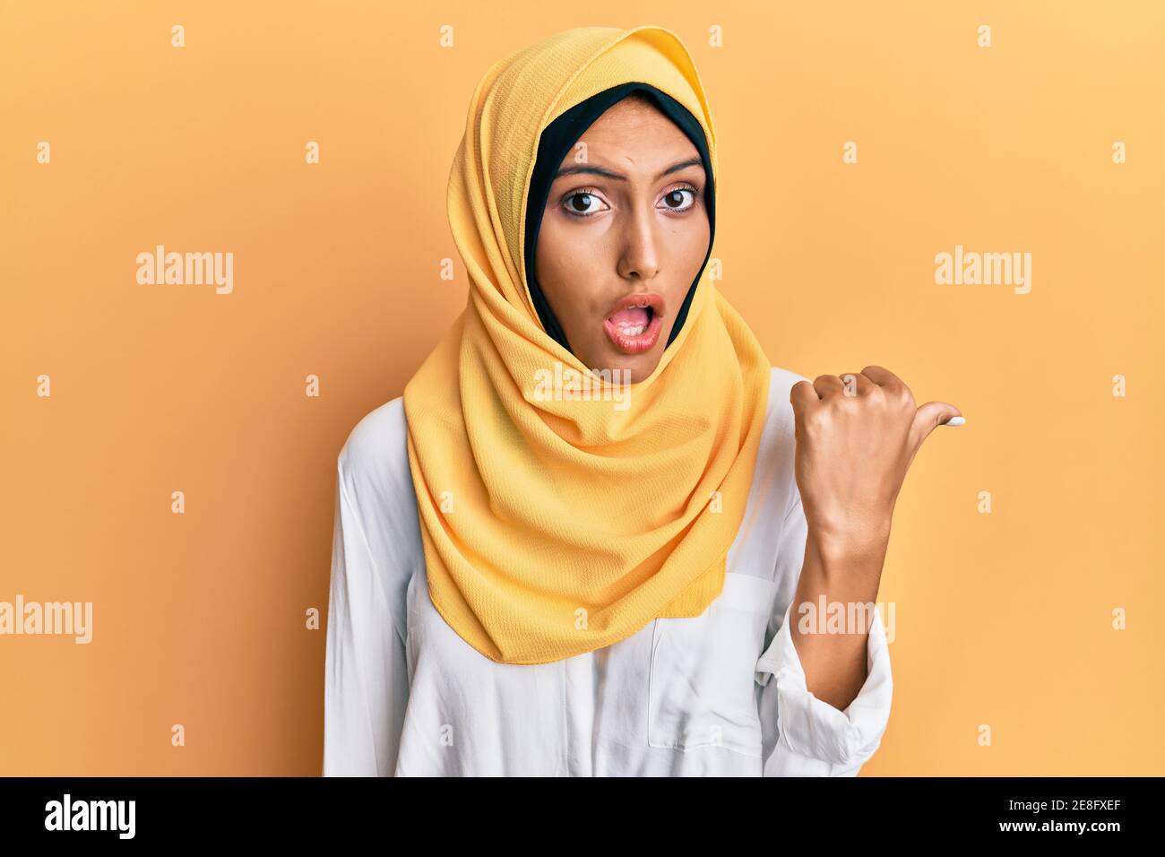 Young brunette arab woman wearing traditional islamic hijab scarf ...