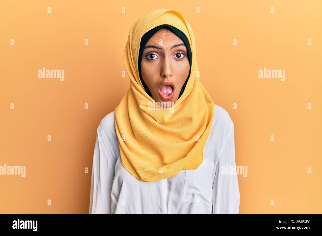 Young brunette arab woman wearing traditional islamic hijab scarf ...