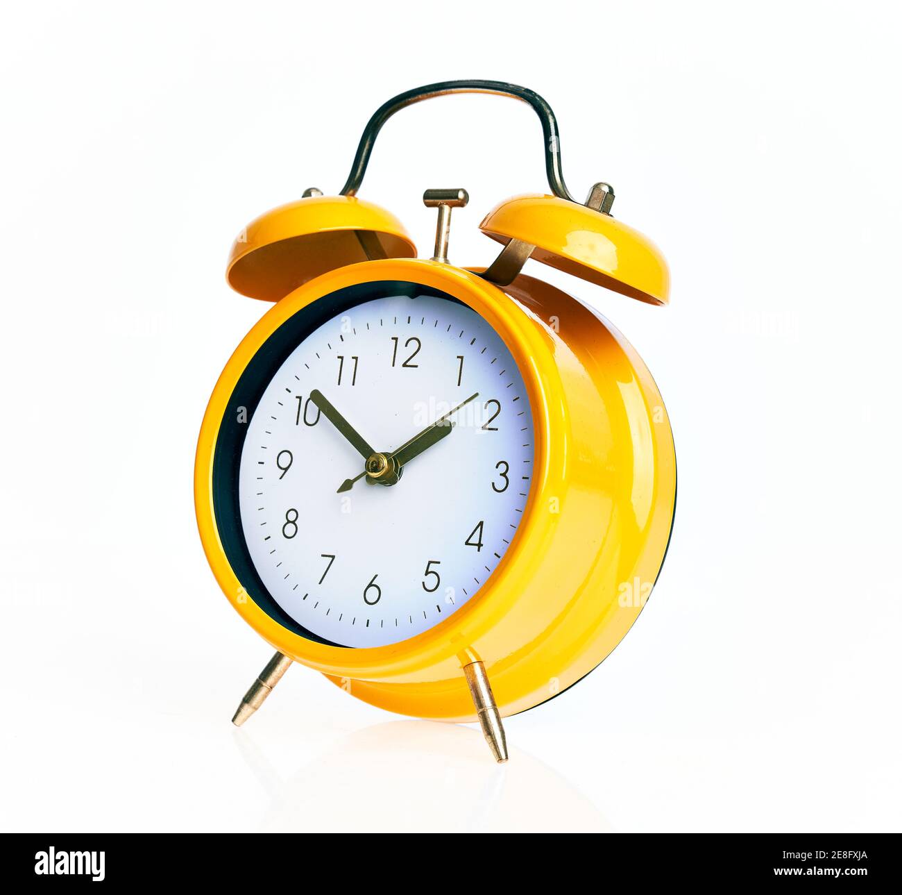 Hand of hispanic man holding yellow alarm clock over isolated white ...