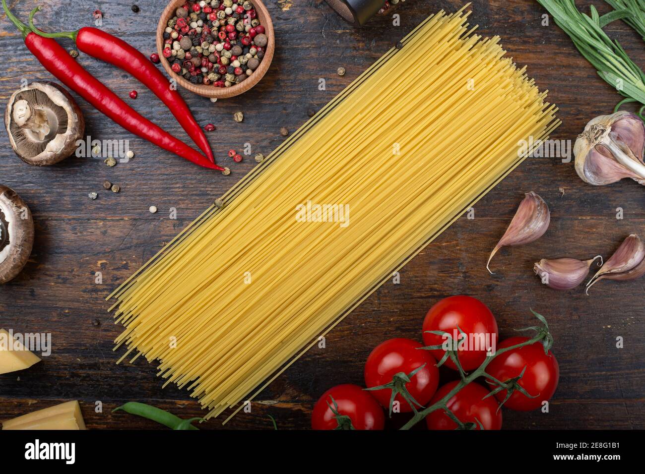 Spaghetti and Ingredients on an old and vintage wooden table. Italian ...