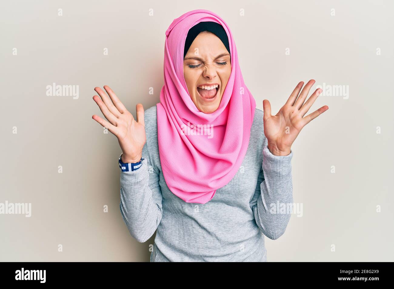 Young caucasian woman wearing traditional islamic hijab scarf ...