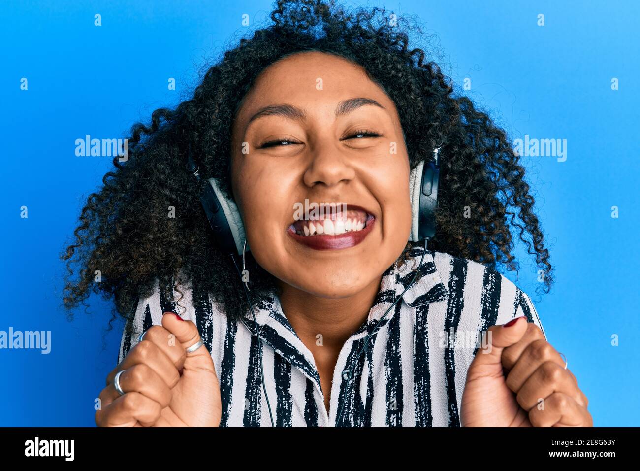 Beautiful african american woman with afro hair wearing call center ...