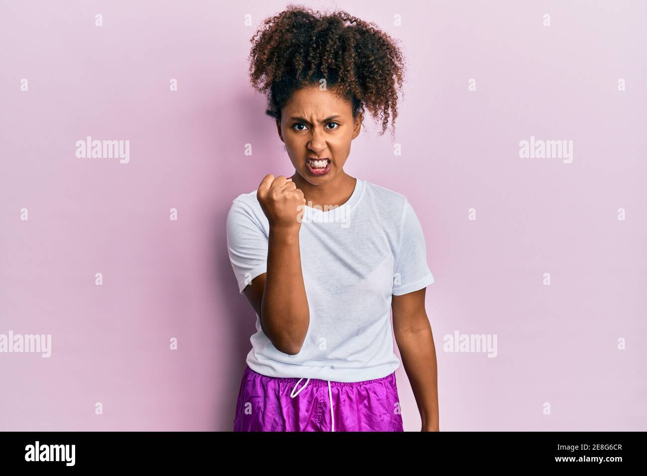 Beautiful african american woman with afro hair wearing sportswear ...
