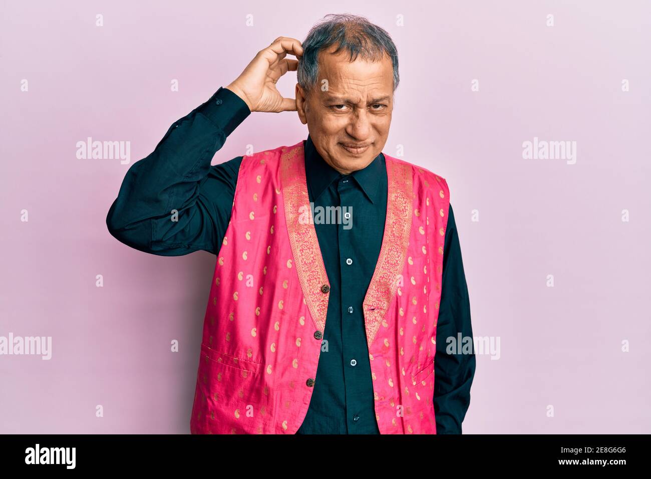 Middle age indian man wearing traditional indian clothes confuse and ...
