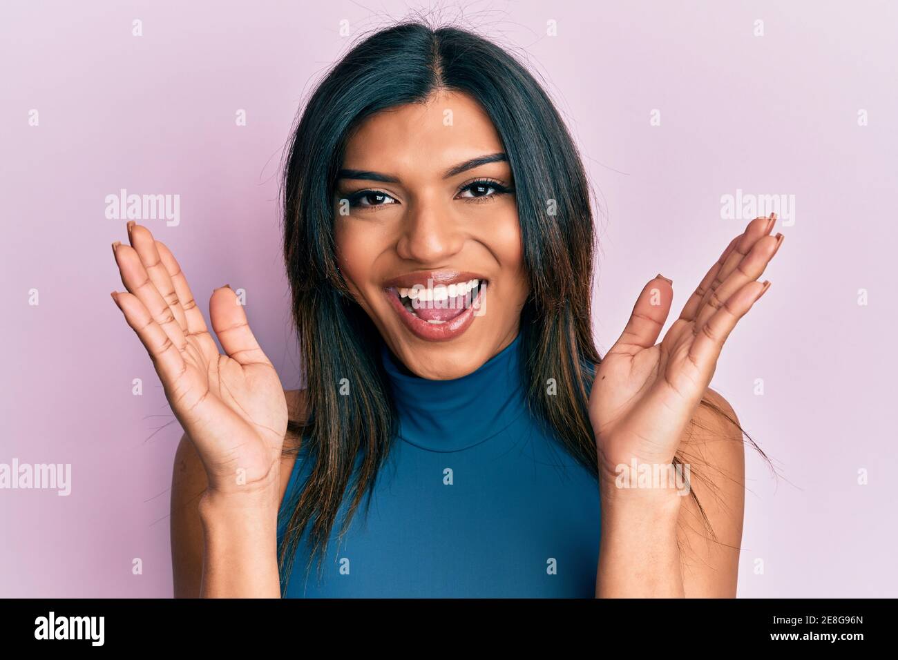 Young latin transsexual transgender woman with hands over face ...