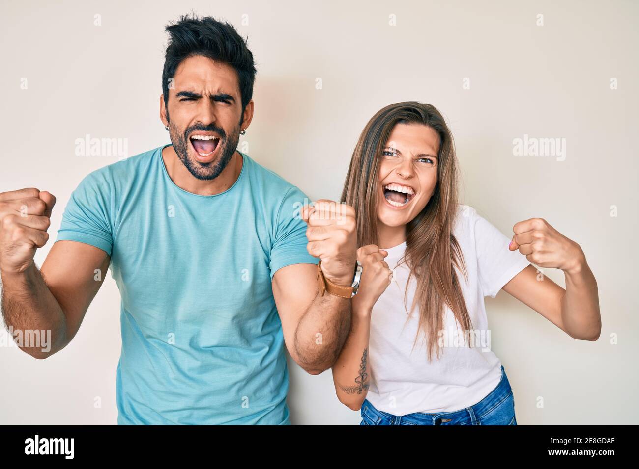 Beautiful young couple of boyfriend and girlfriend together angry and ...