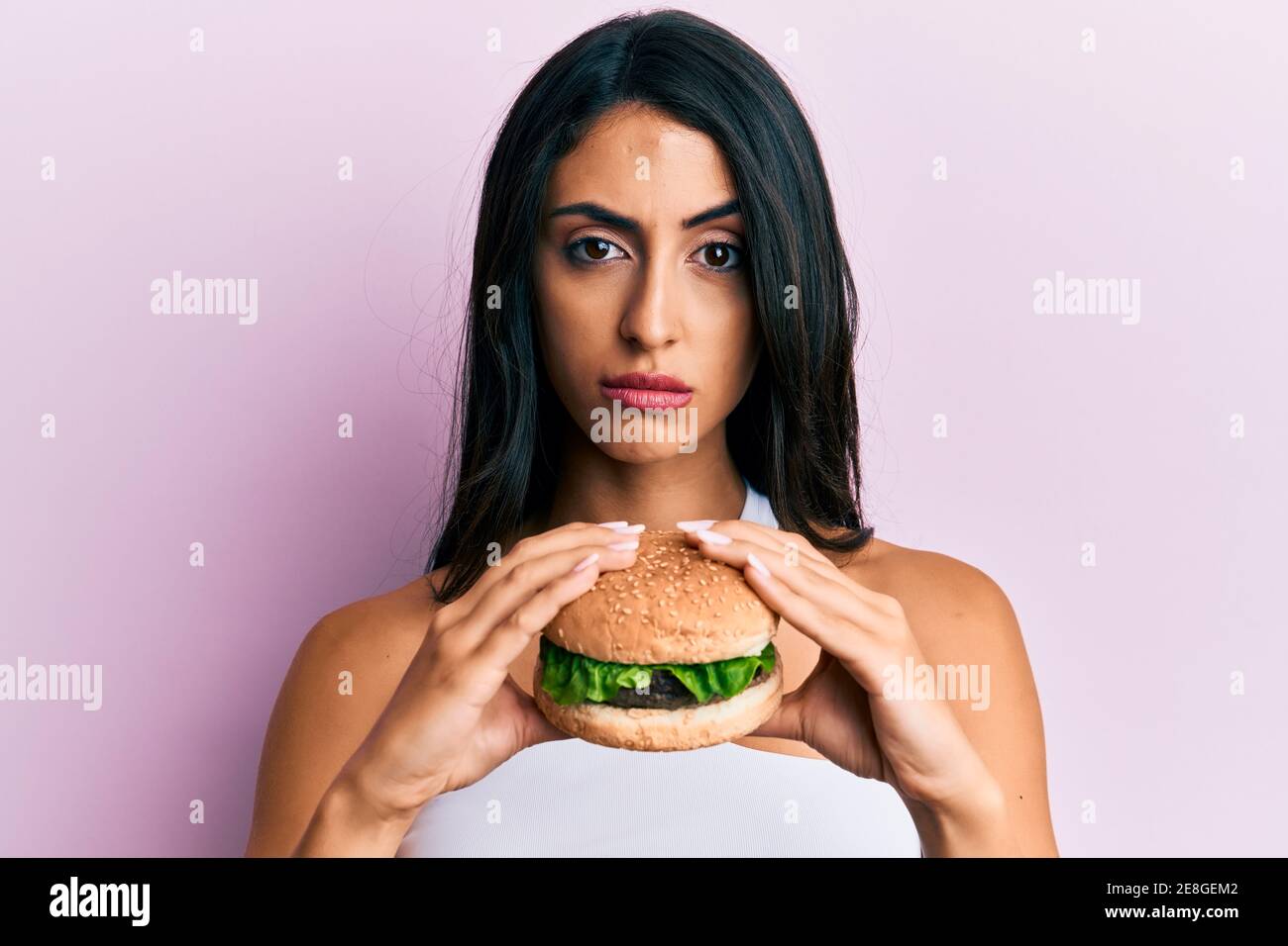 Nervous person eating hamburger hi-res stock photography and images - Alamy