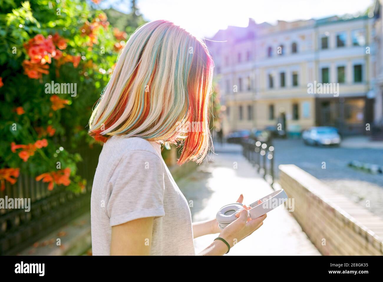 Close-up of teenager girl's head with multi-colored dyed hair, complex ...