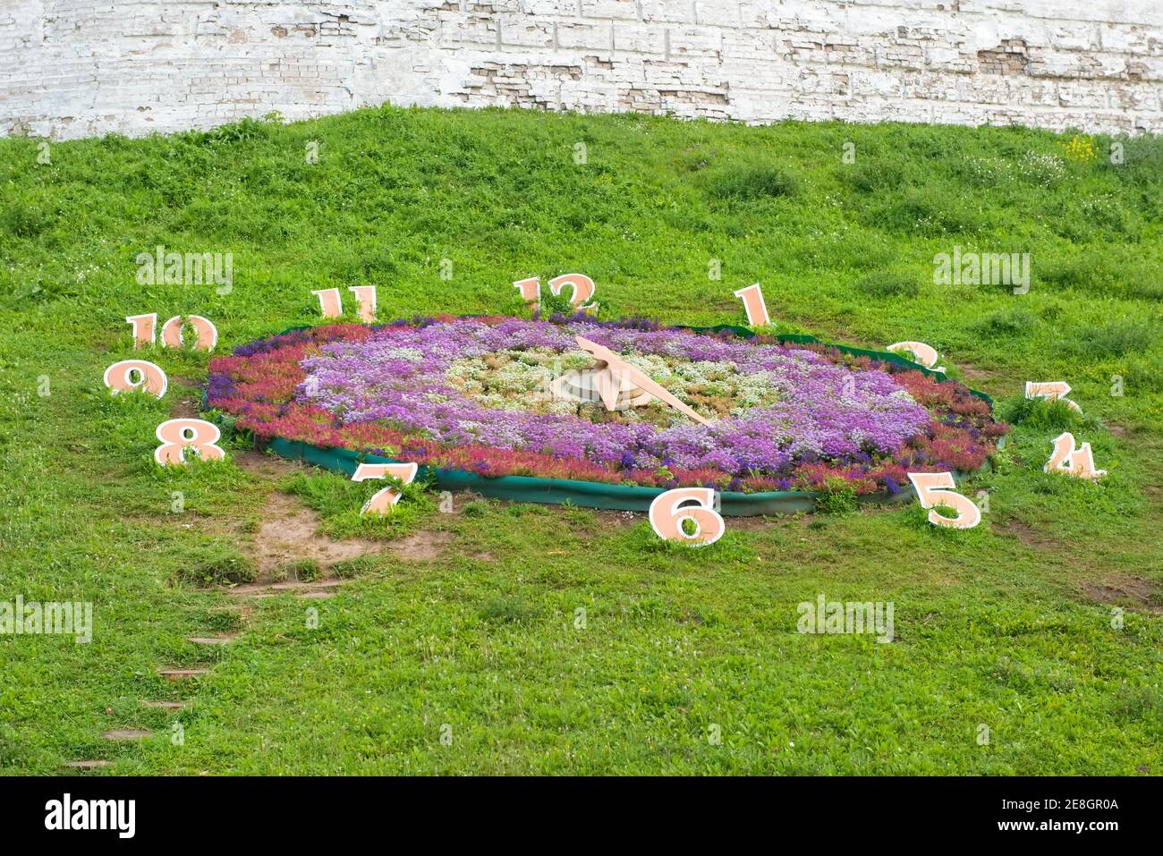 Flower clock in the public park on a summer evening Stock Photo - Alamy