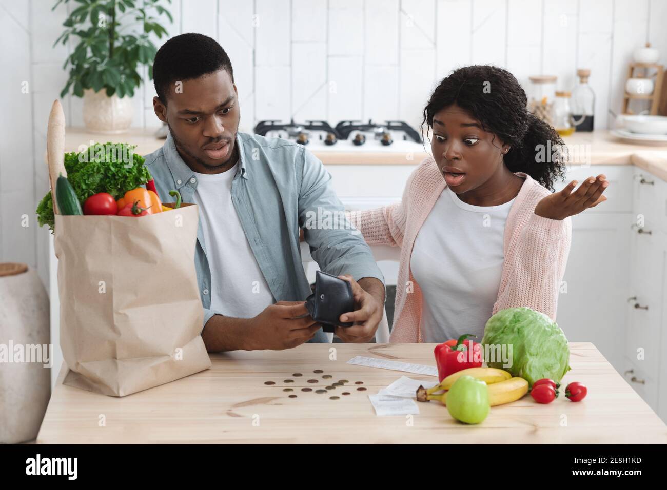 Frustrated African American Couple In Kitchen Counting Remaining Money ...