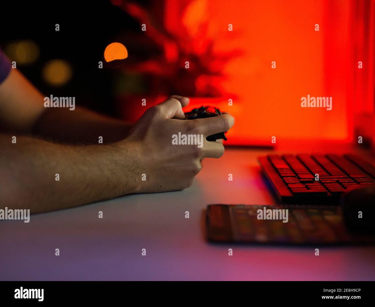 Crop unrecognizable male gamer using gamepad and playing video game ...