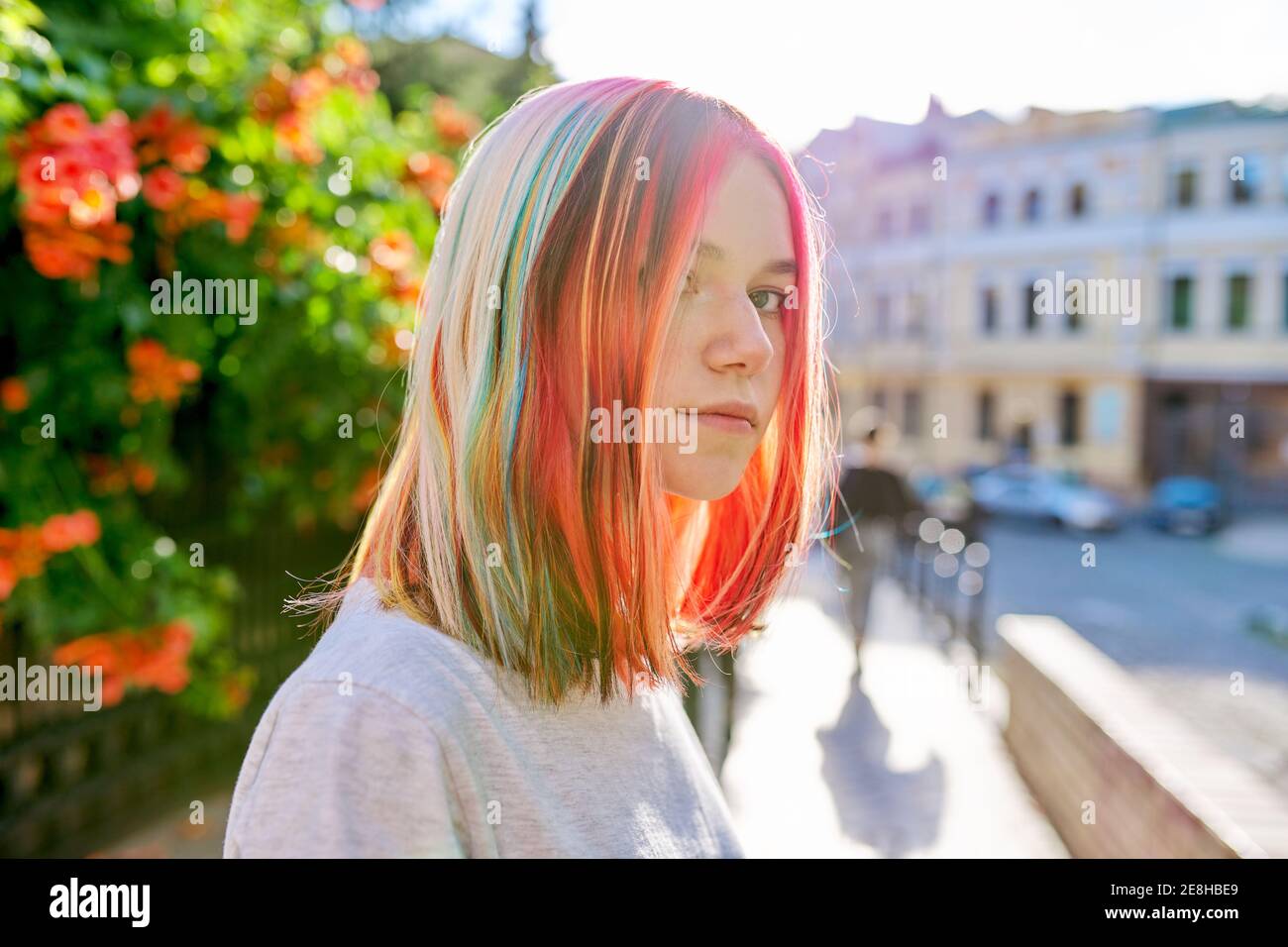 Close-up of teenager girl's head with multi-colored dyed hair, complex ...