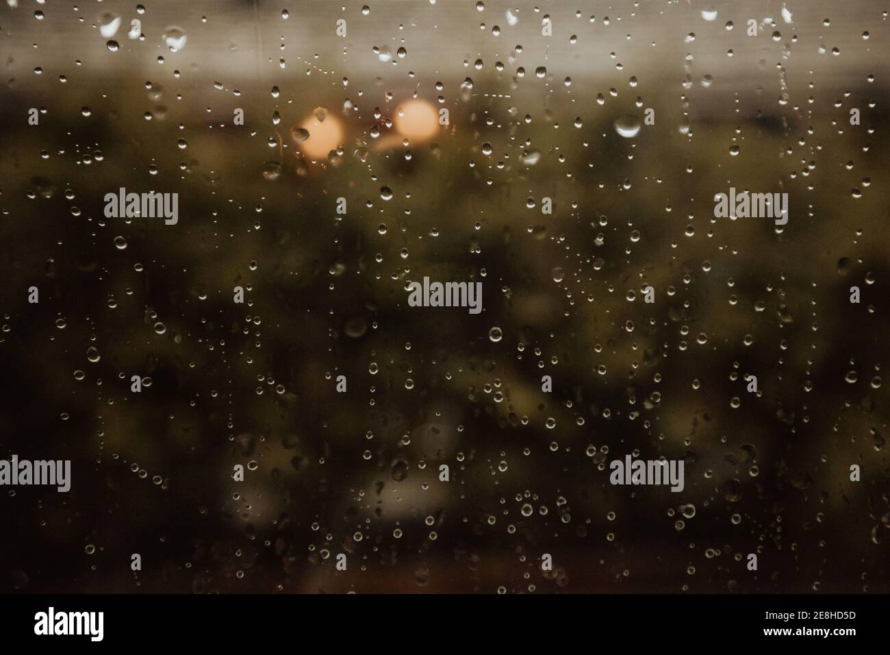 Textured backdrop of translucent wet glass with pure water drips in ...